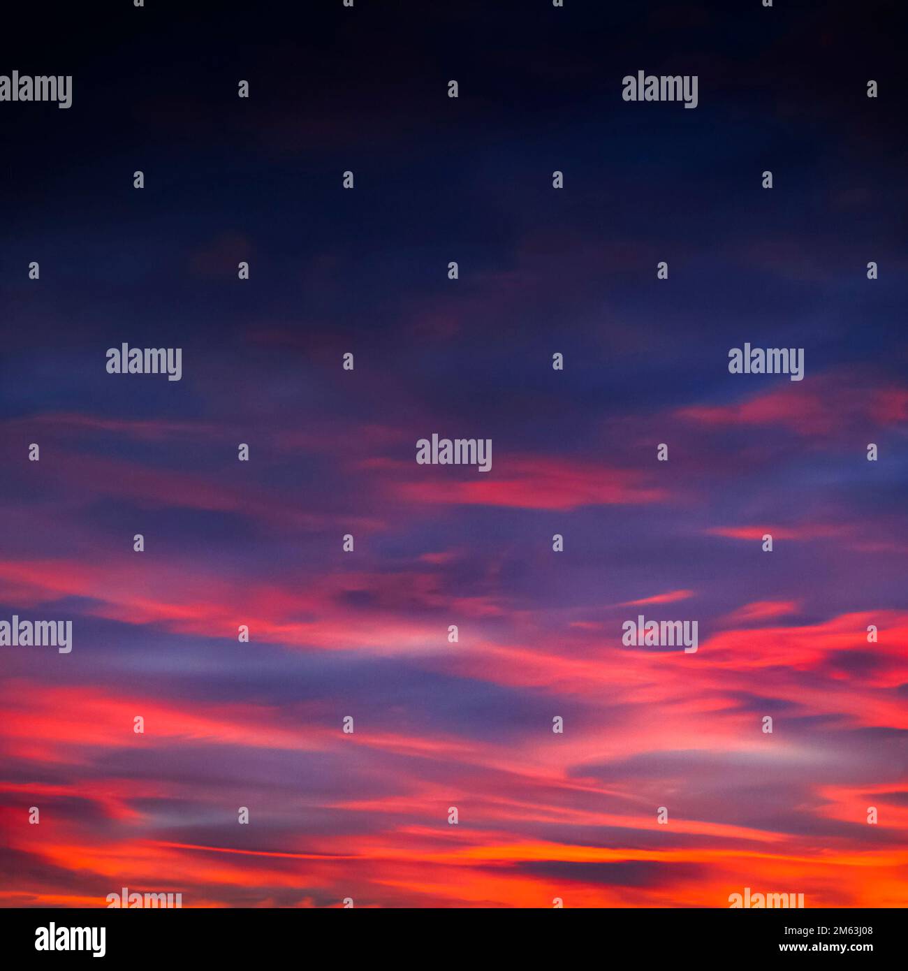 Thick clouds are illuminated by the setting sun Stock Photo - Alamy
