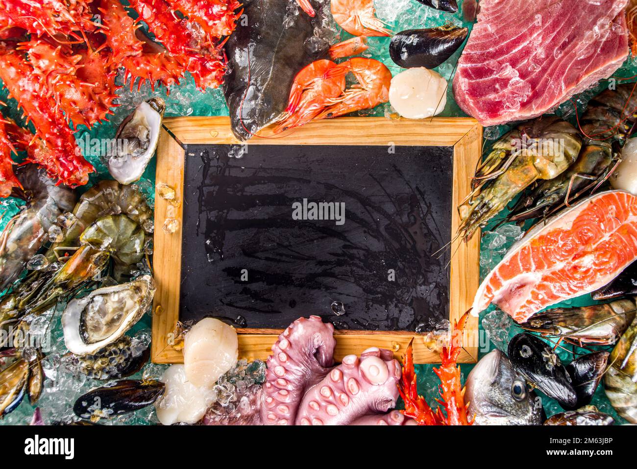 Set of various fresh raw seafood - octopus, crab, squid, shrimp prawn ...