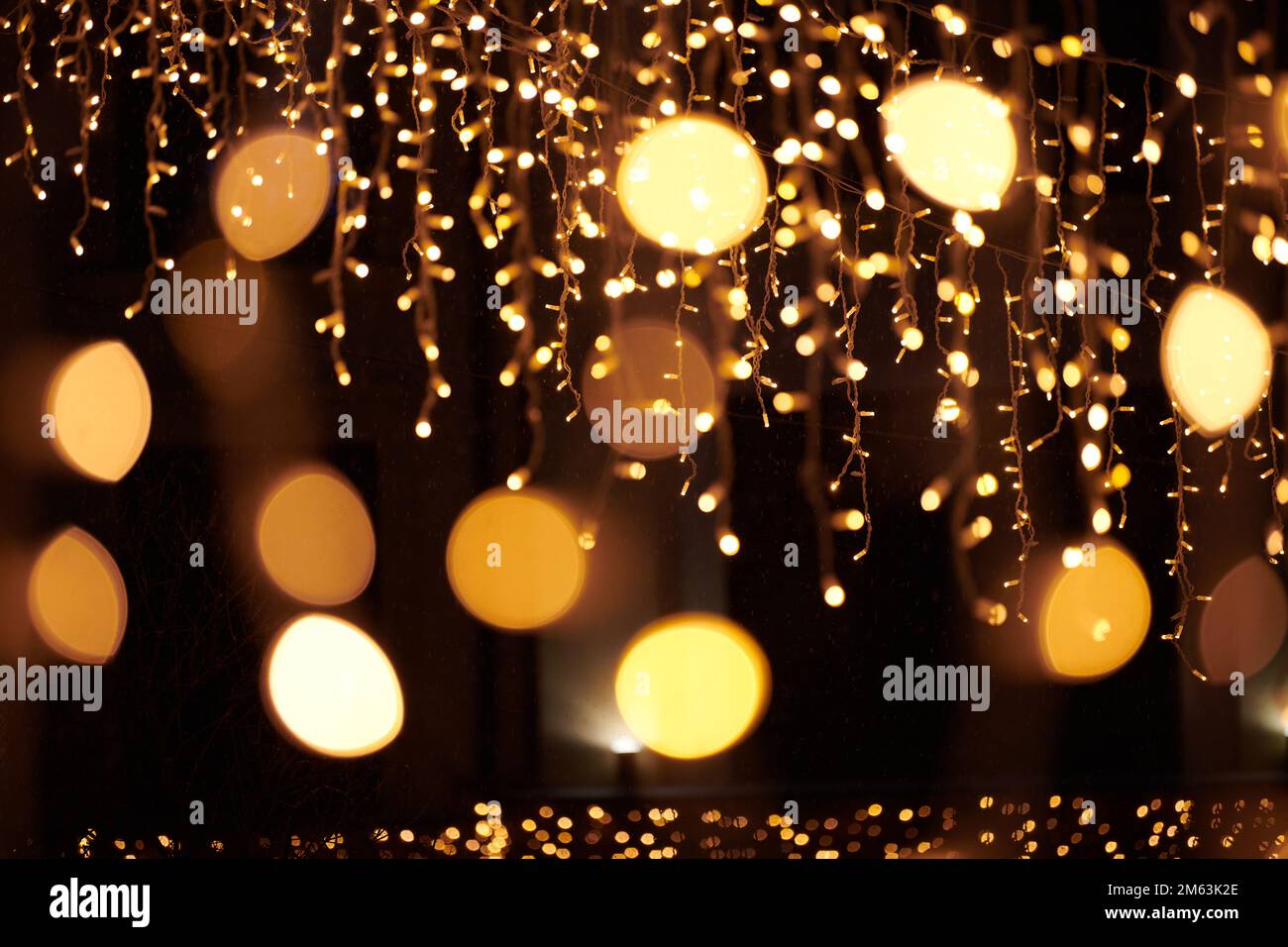 Yellow lights bokeh from christmas holiday garlands, blurred festive ...