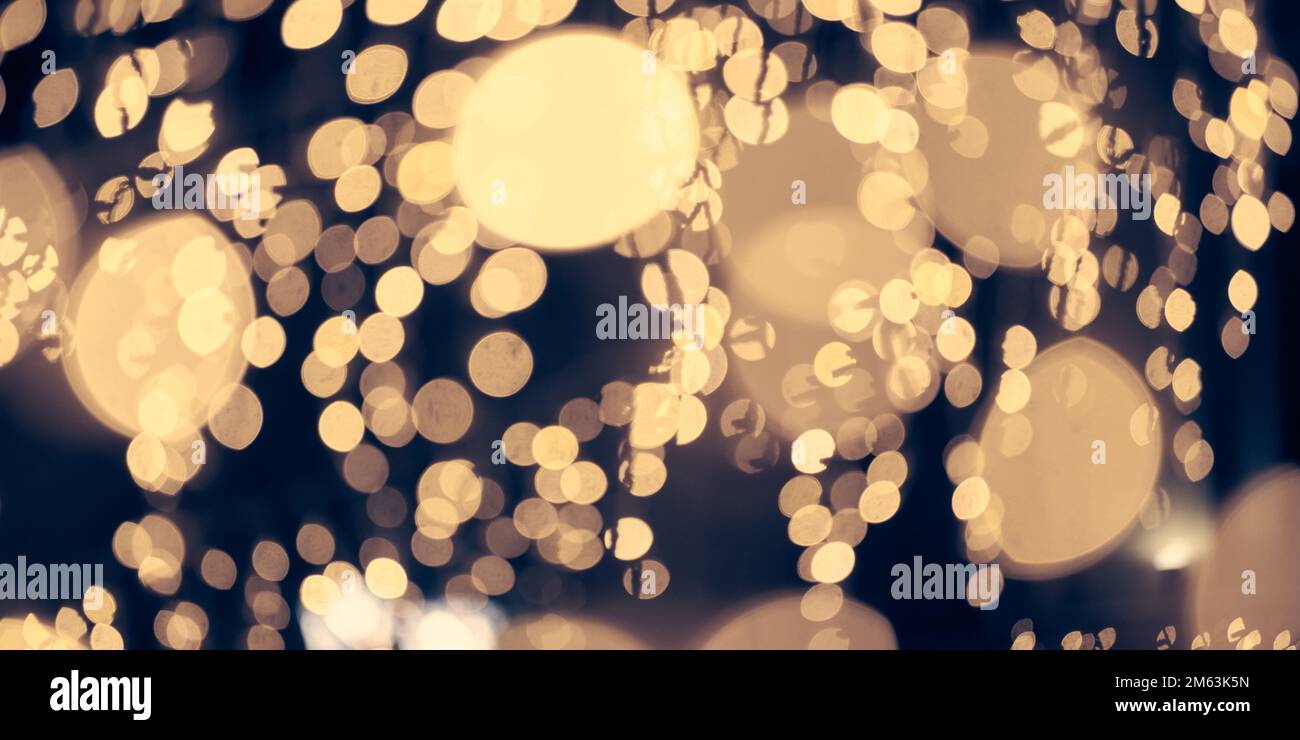Pale yellow lights bokeh from christmas holiday garlands, blurred ...