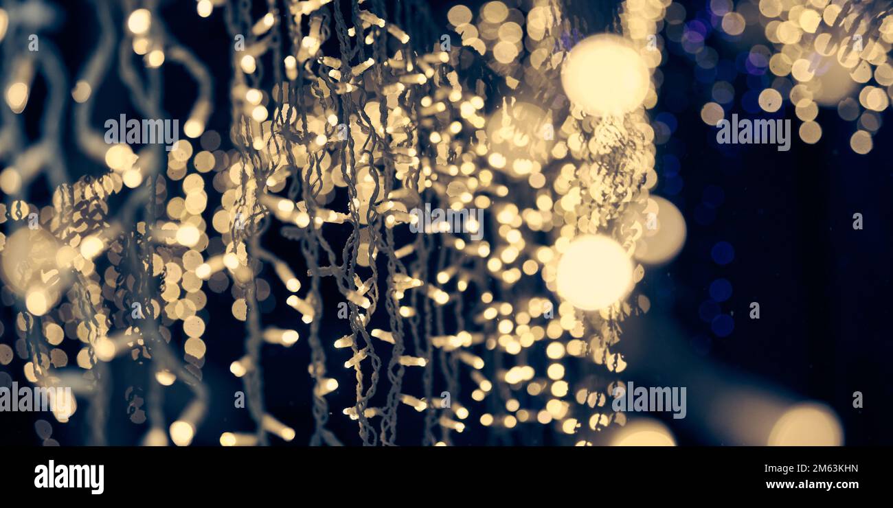 Pale yellow lights bokeh from christmas holiday garlands, blurred ...