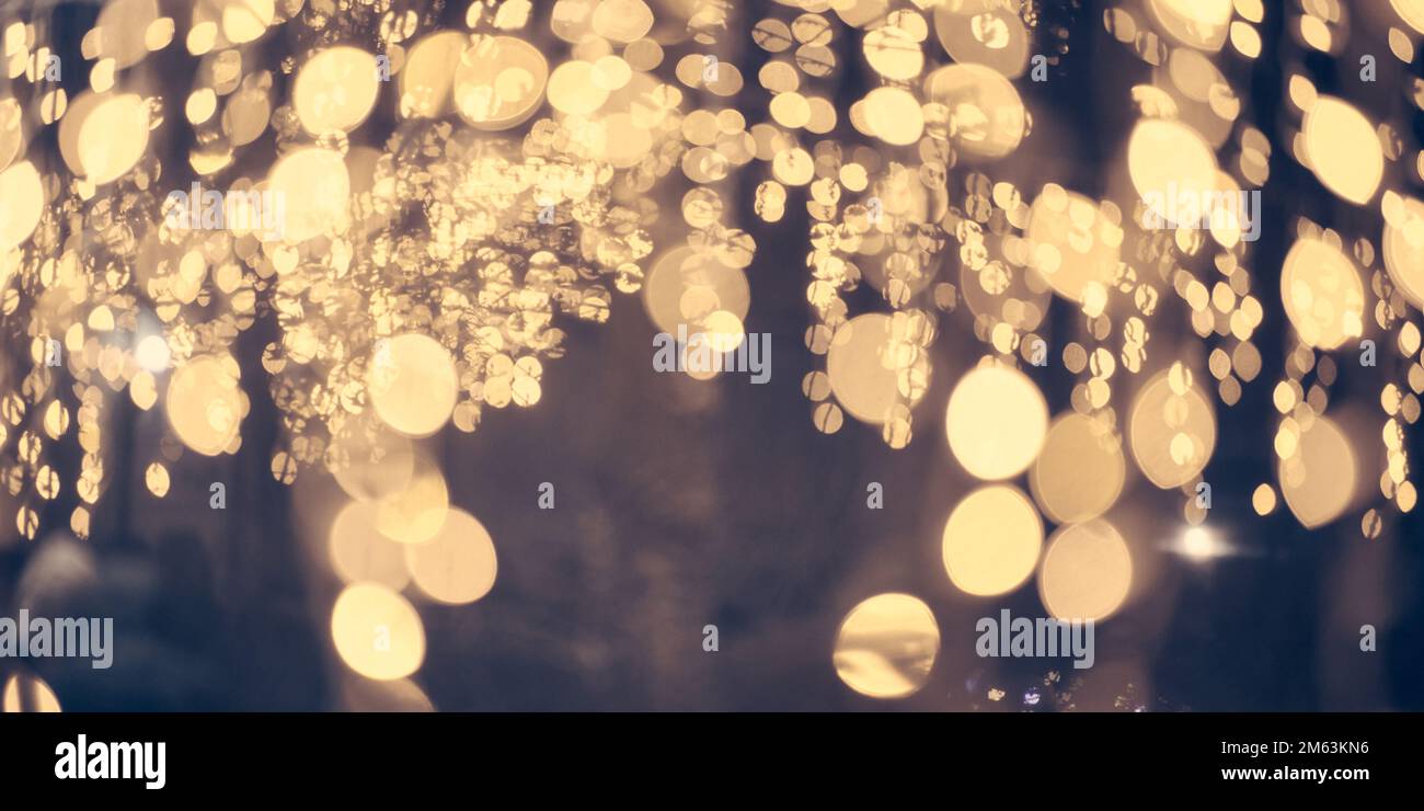 Pale yellow lights bokeh from christmas holiday garlands, blurred ...