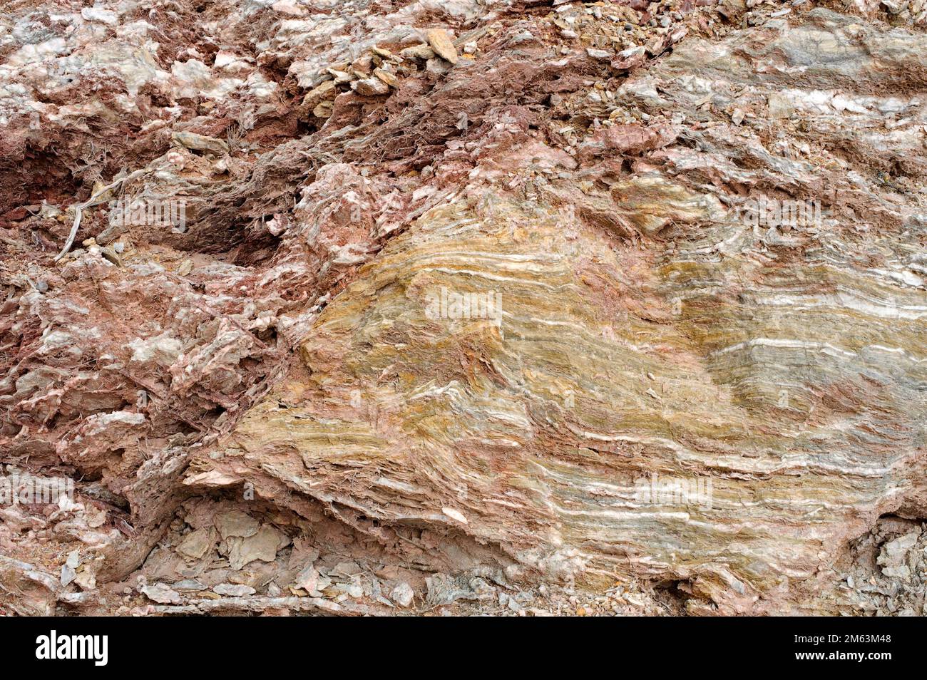 Colorful gypsum and clay strata with a fault. This photo was taken in ...