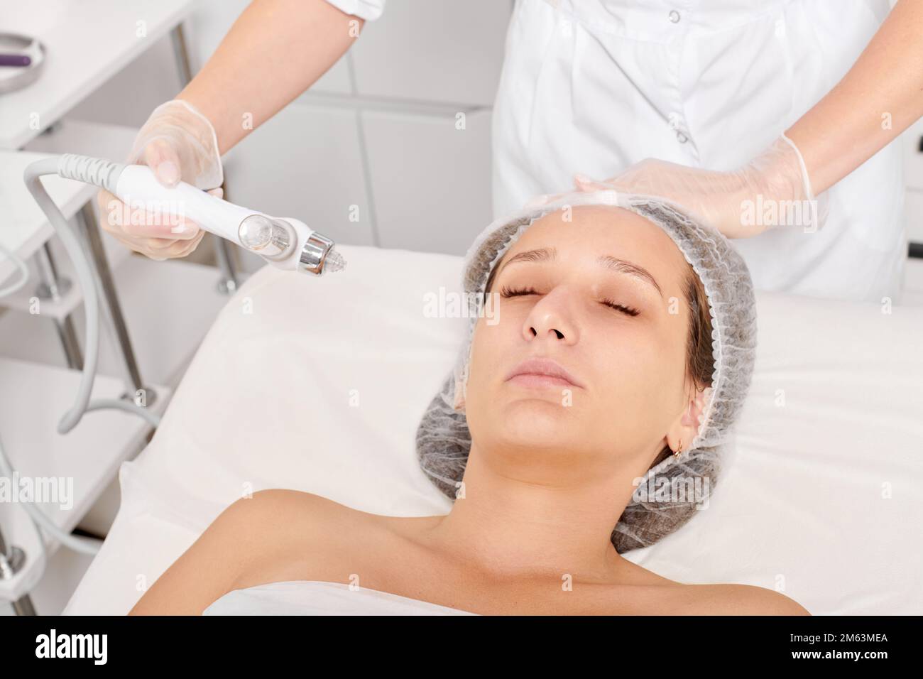 Cosmetologist makes facial gas liquid oxygen serum epidermal peeling ...