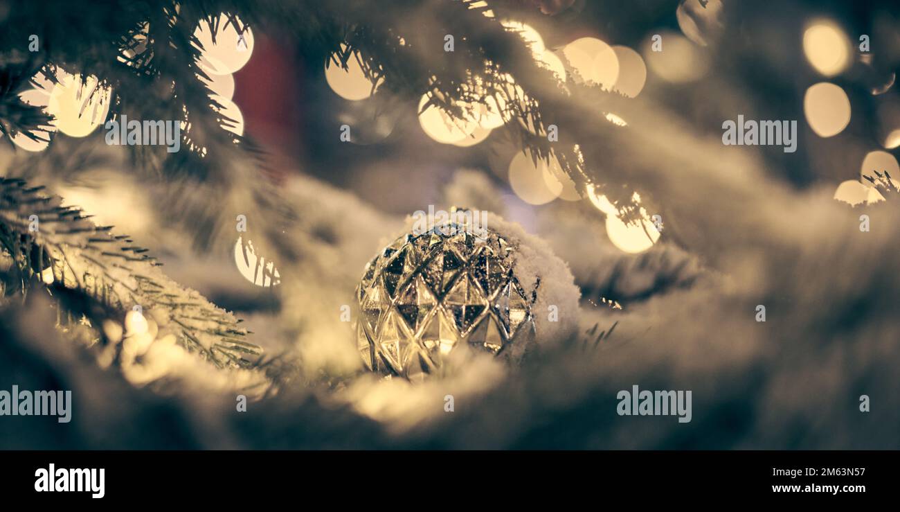 Green Christmas tree covered snow with white decorative bulb and yellow ...