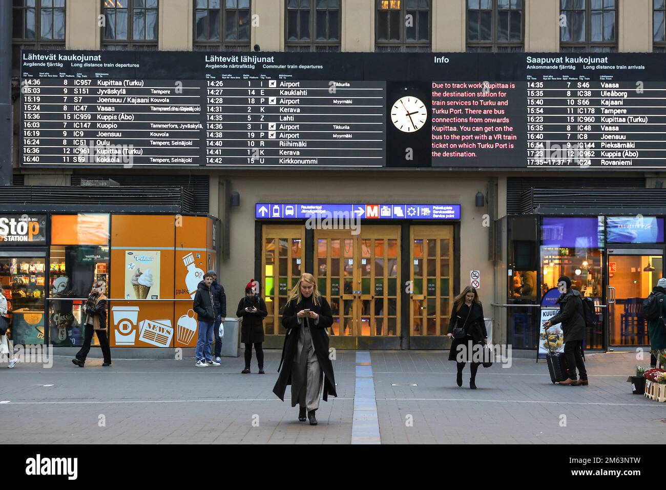 Passengers walk along the platform of the Helsinki Central Railway ...