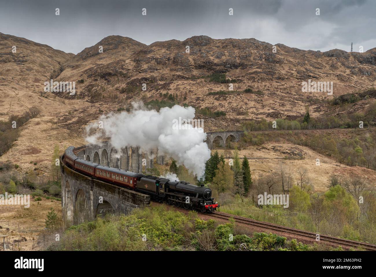 Glenfinnan Railway Viaduct with a steam train crossing the famous ...