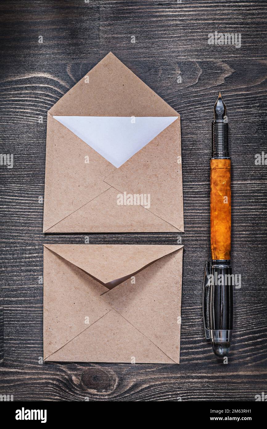 Vintage post envelopes letter fountain pen on wooden board Stock Photo ...