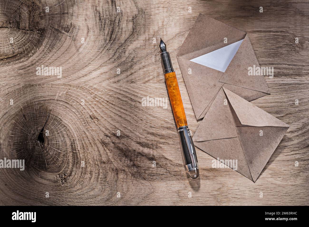 Vintage envelopes fountain pen on wooden board Stock Photo - Alamy
