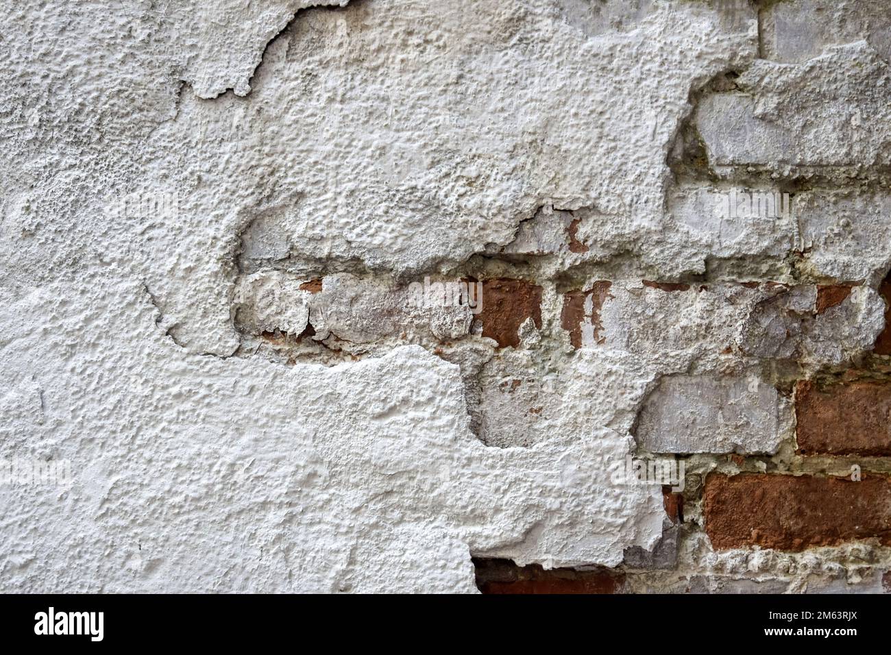 Texture of old brick wall with collapsed plaster. Background of shabby ...