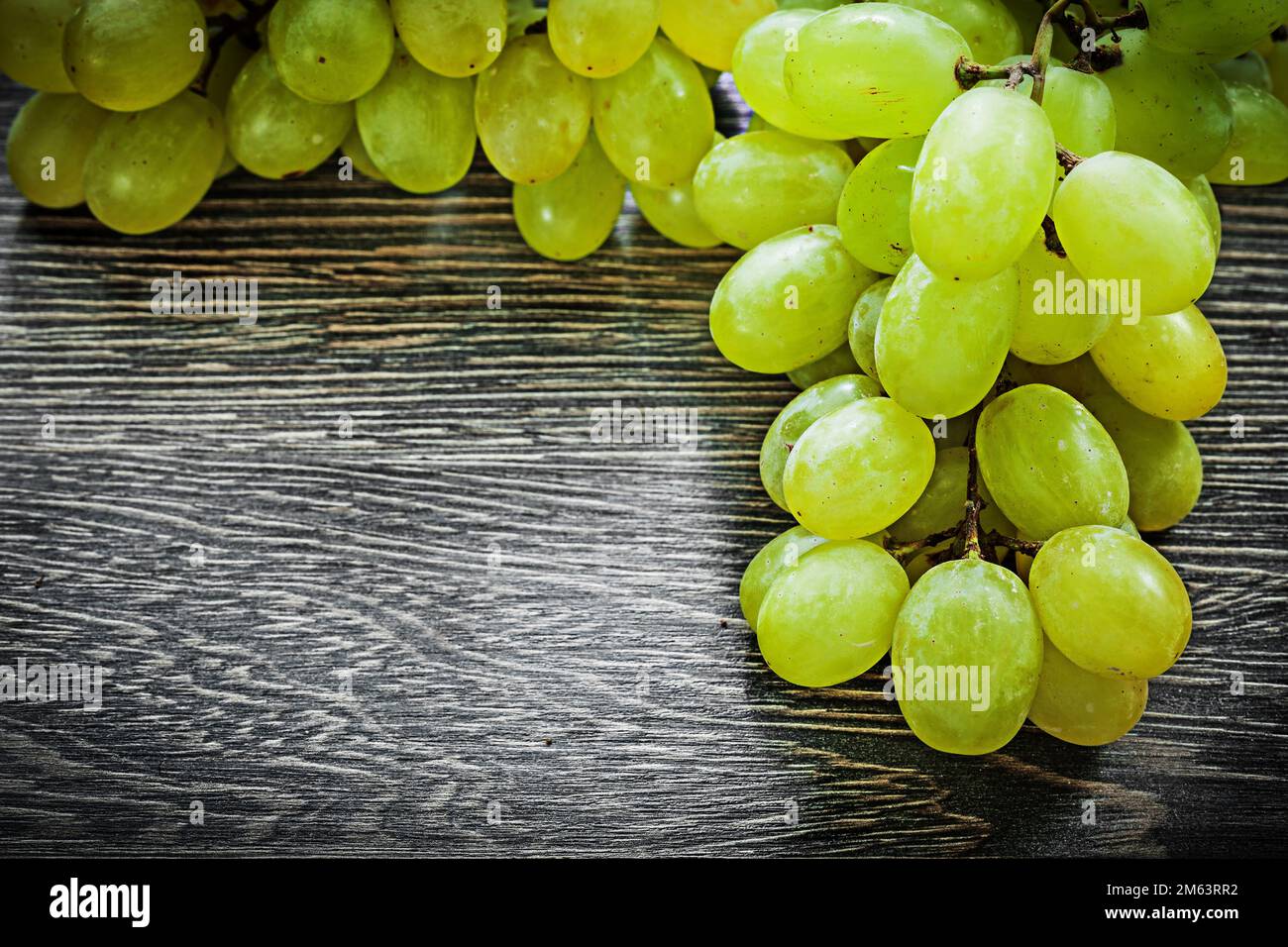 White grapes on wooden board top view Stock Photo - Alamy