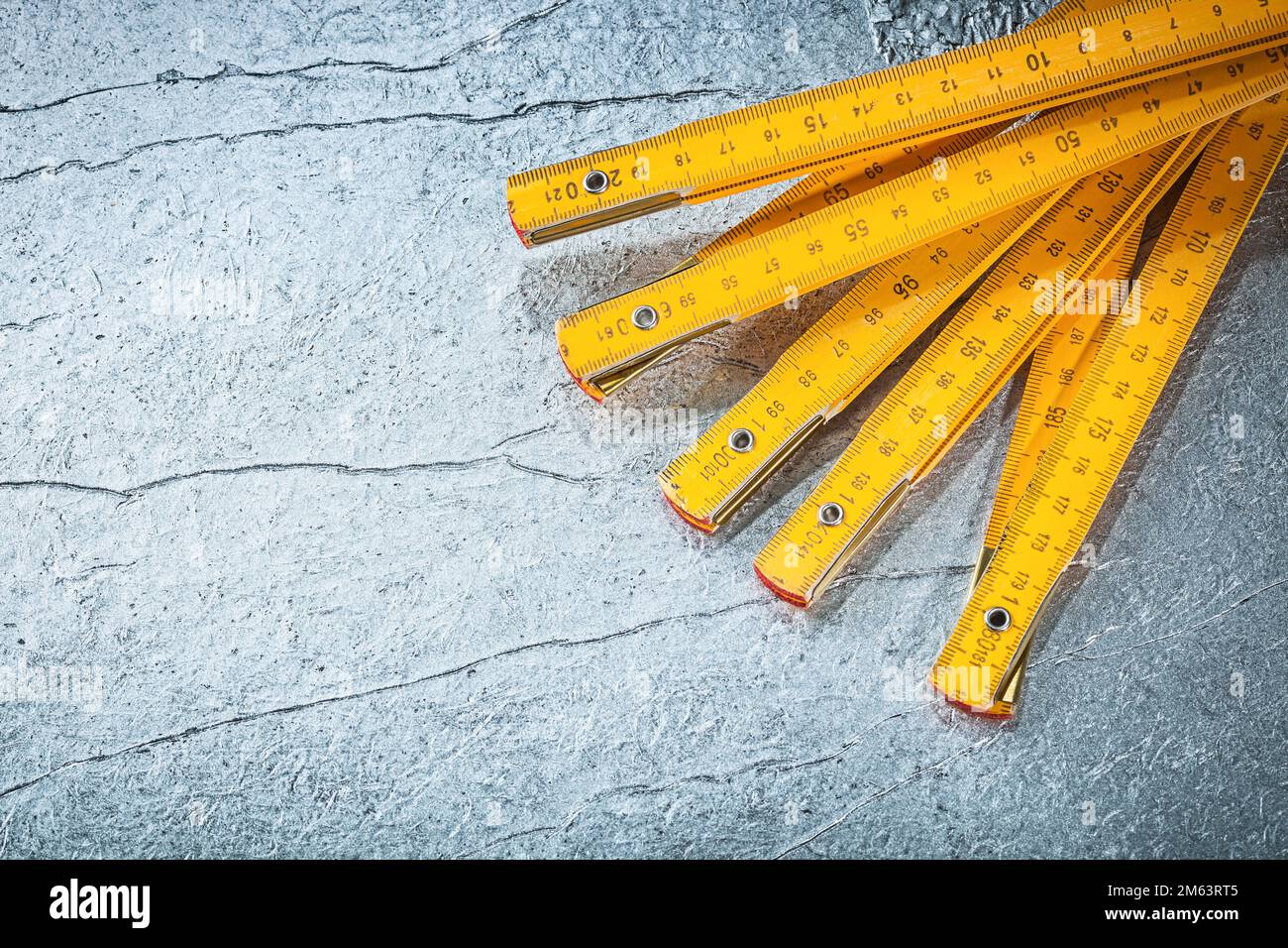 Wooden meter on metallic background construction concept Stock Photo ...