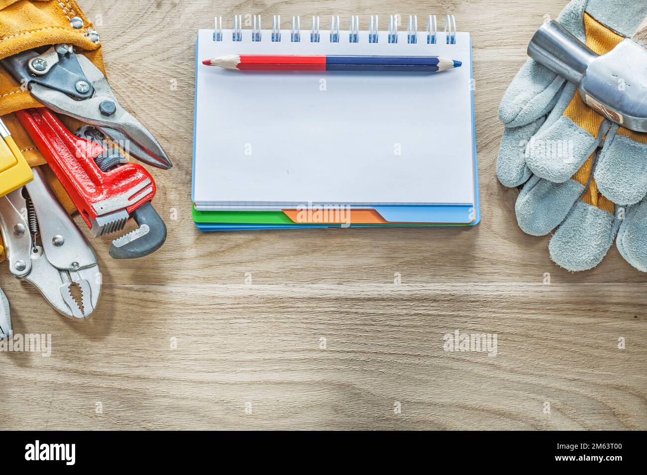 Construction tooling tool belt safety gloves claw hammer notepad pencil ...