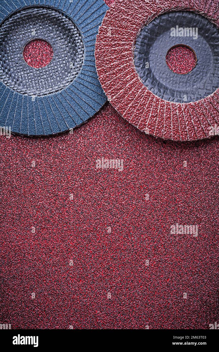 Abrasive flap wheels on sandpaper top view Stock Photo - Alamy