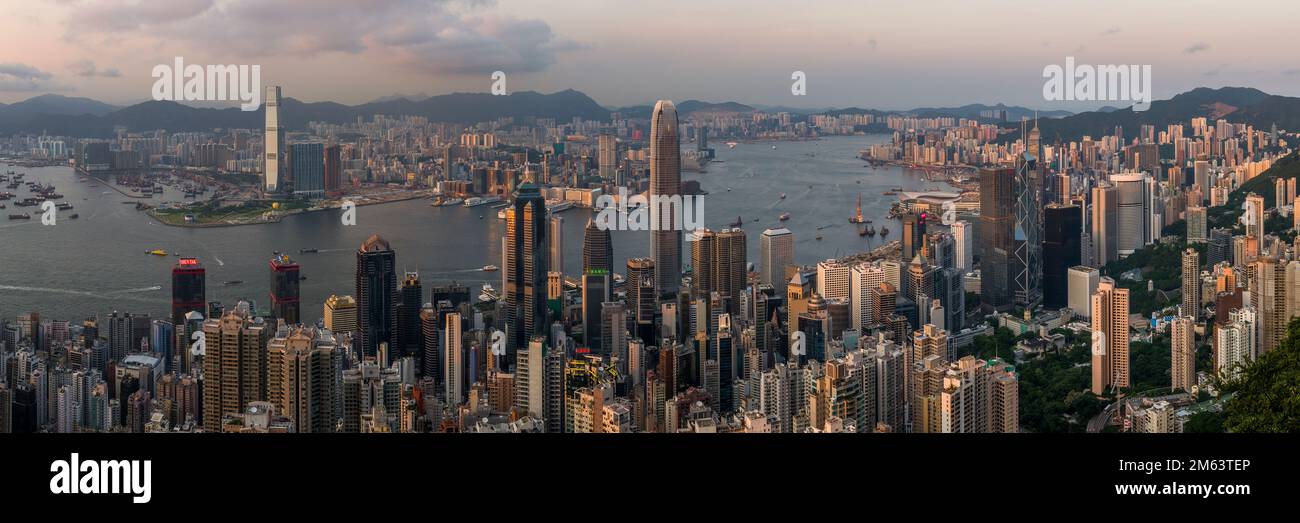 Panorama of Hong Kong Island, Victoria Harbour and Kowloon at sunset, looking north from The ...