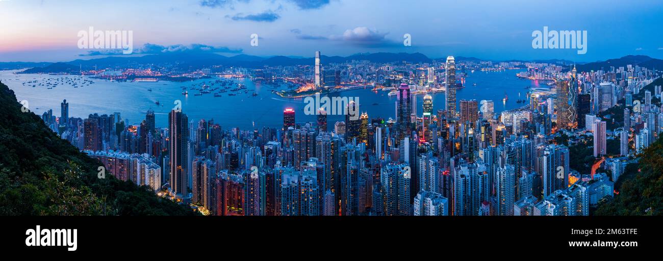 Panorama of Hong Kong Island, Victoria Harbour and Kowloon at dusk ...