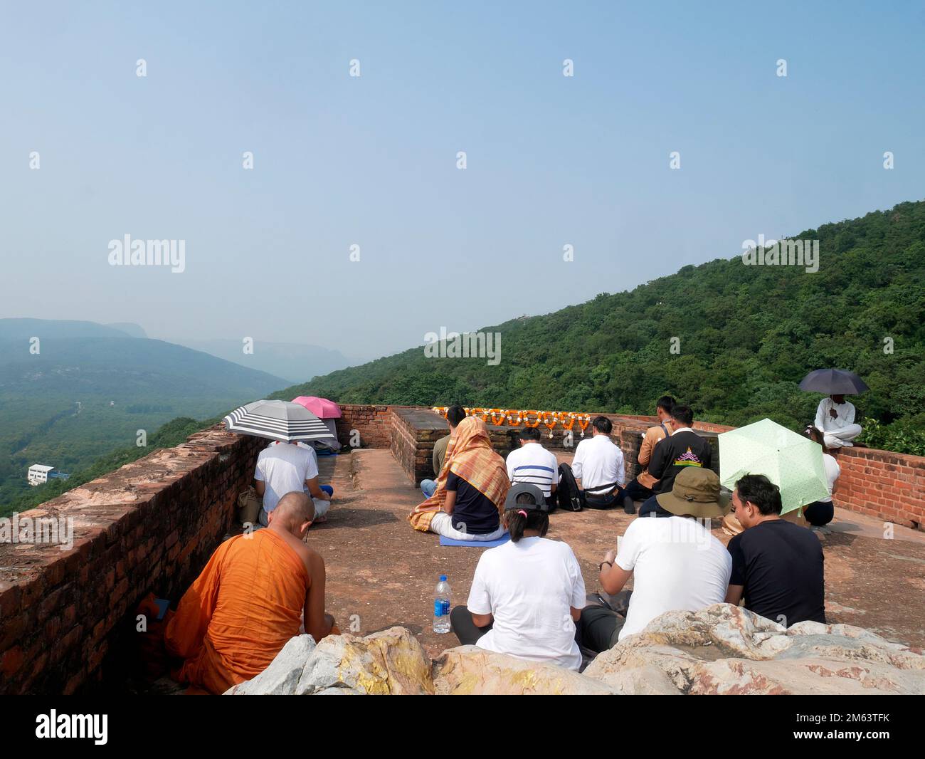 PILGRIMS AND A MONK MEDITATING AT VULTURES PEAK, RAJGIR, BIHAR, INDIA ...