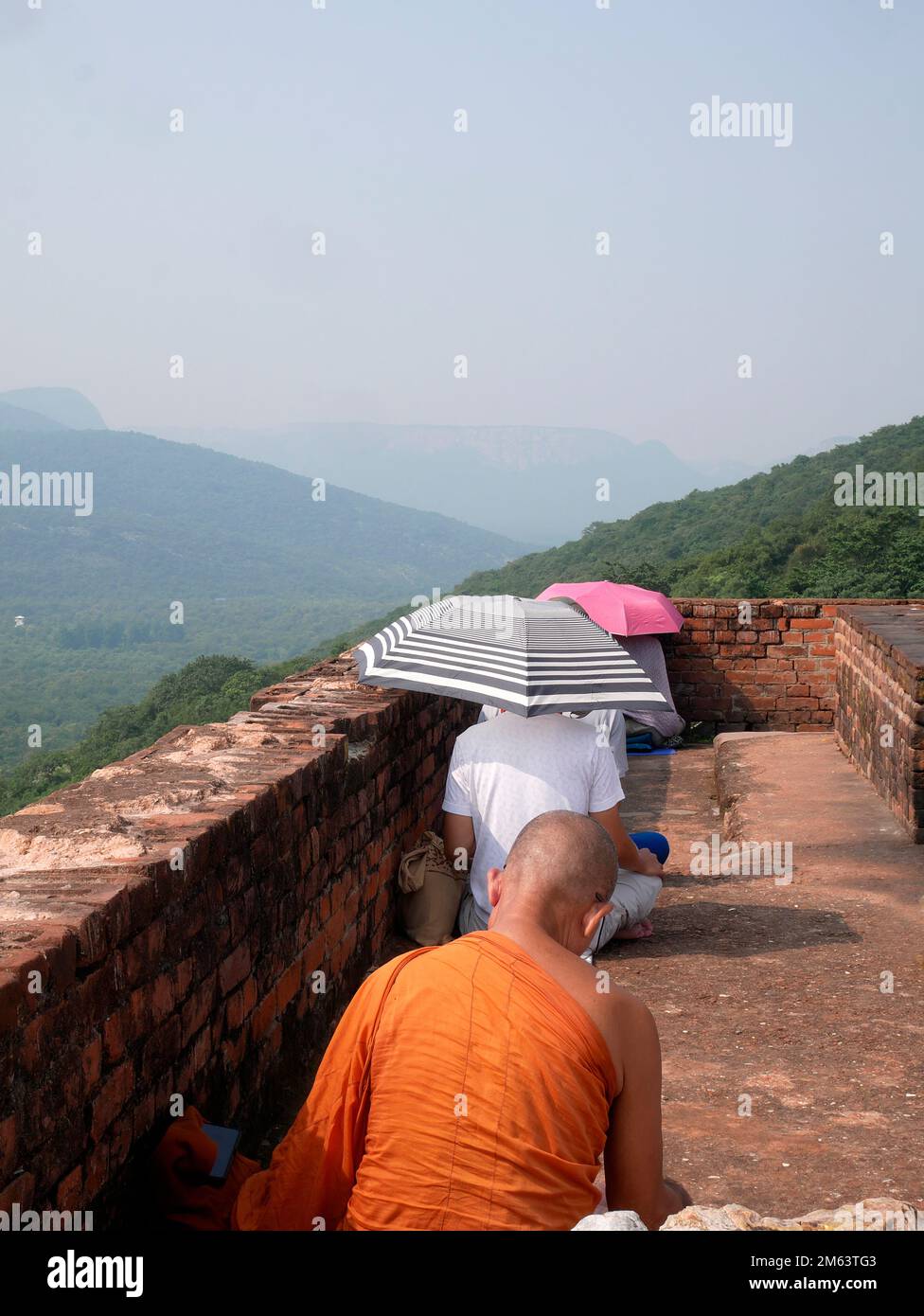 PILGRIMS AND A MONK MEDITATING AT VULTURES PEAK, RAJGIR, BIHAR, INDIA ...