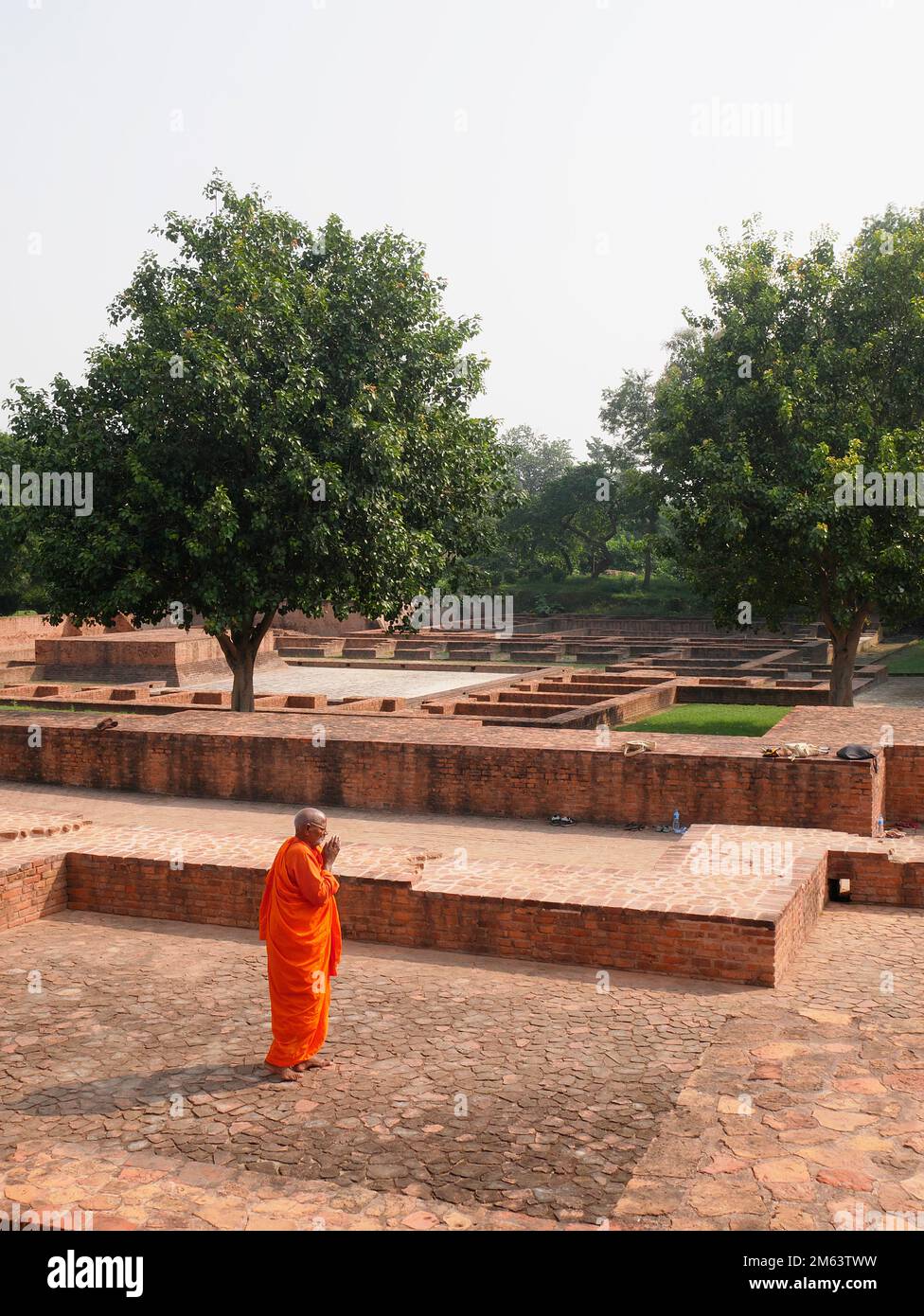 MONK CIRCUMAMBULATING IN PRAYER AROUND THE GANDHAKUTI, JETAVAN ...