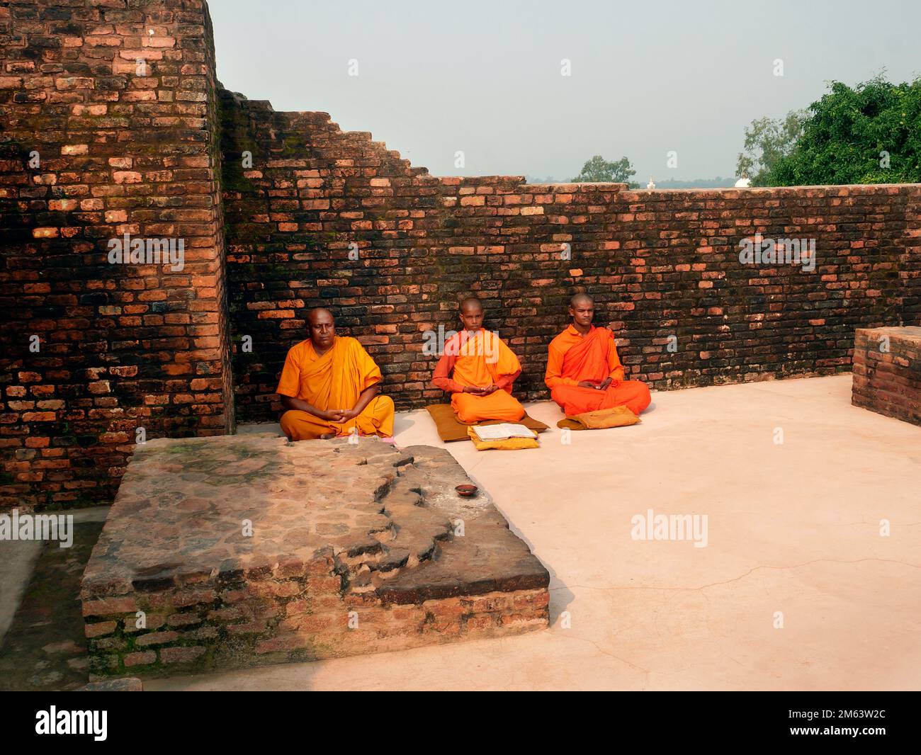 MONKS MEDITATING CHANTING AT THE MIRACLE STUPA, SHRAVASTI, UTTAR ...