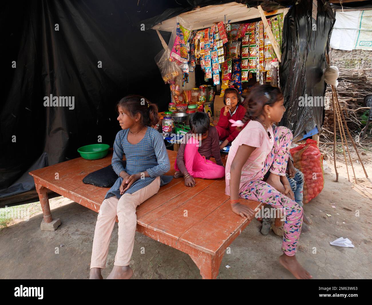A SMALL RURAL VILLAGE SHOP IN SHRAVASTI WITH CHILDREN, UTTAR PRADESH ...