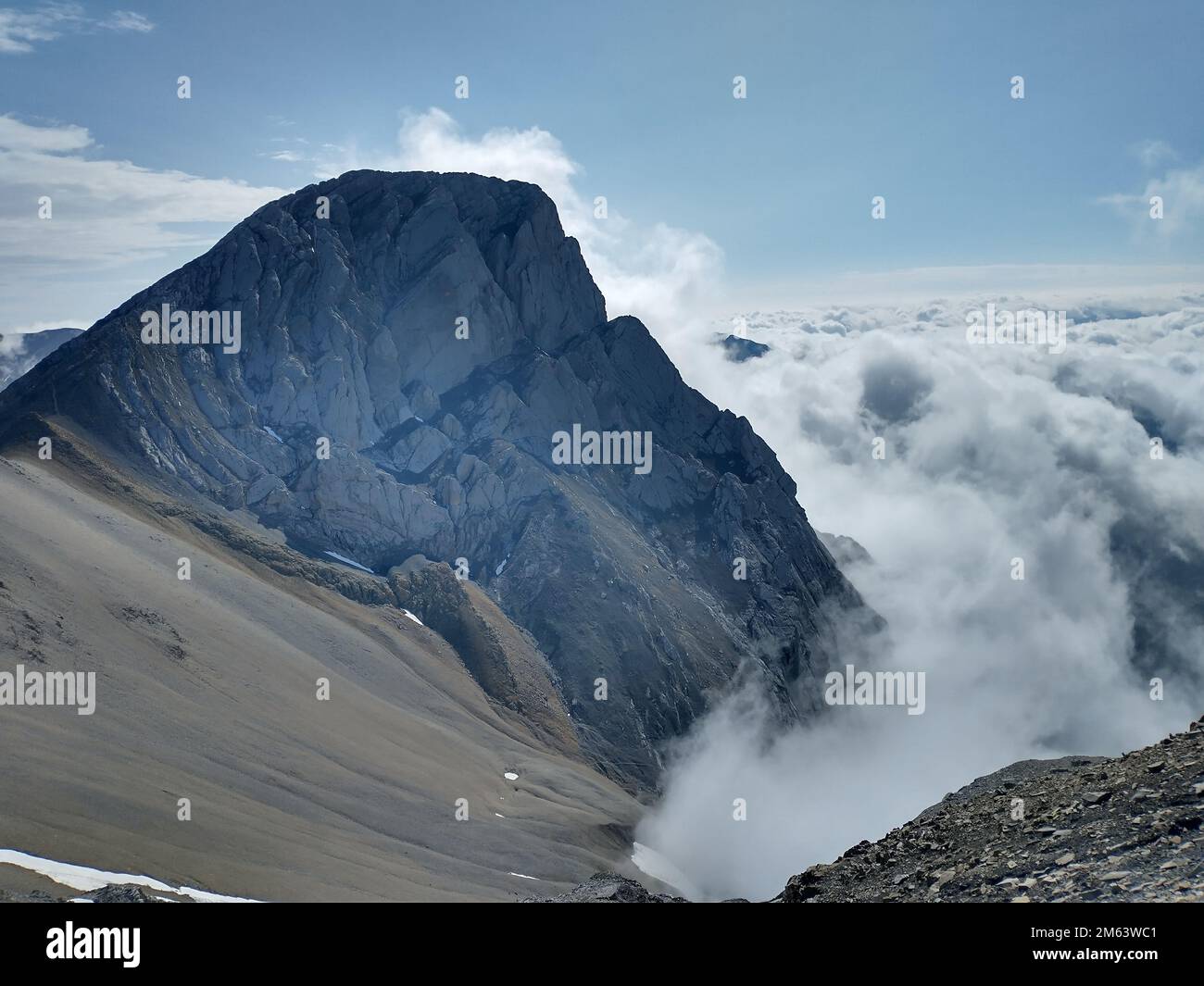 A beautiful view of Mount Fable rising above the clouds in Canmore ...