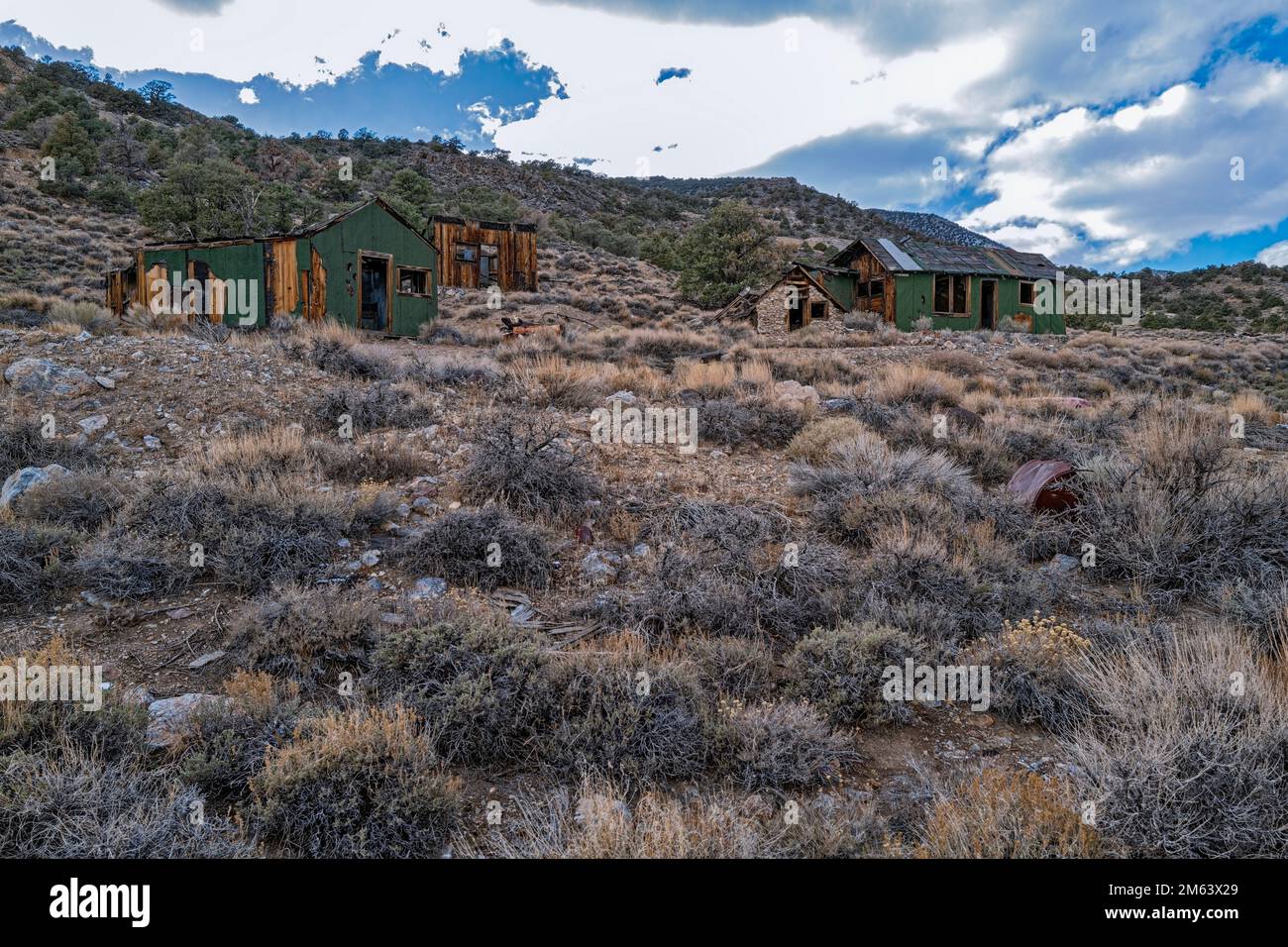 Remnants of shacks remain standing among the sagebrush at an abandoned ...