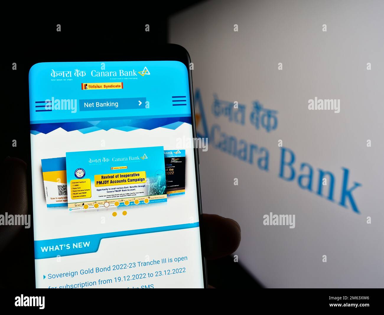 Person holding smartphone with webpage of Indian financial company ...
