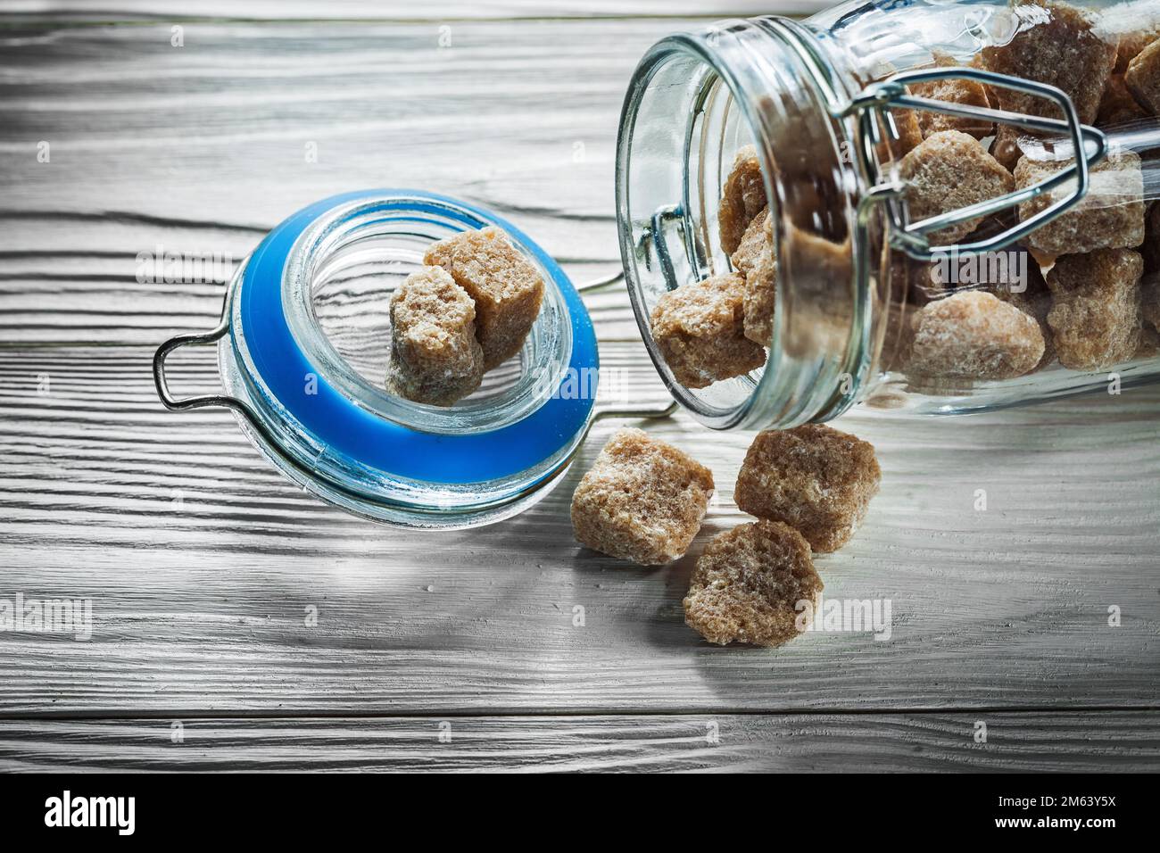 Brown sugar jar on wooden board Stock Photo - Alamy