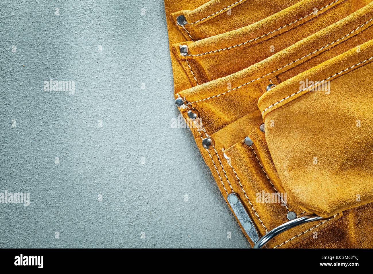 Building belt on concrete background Stock Photo - Alamy