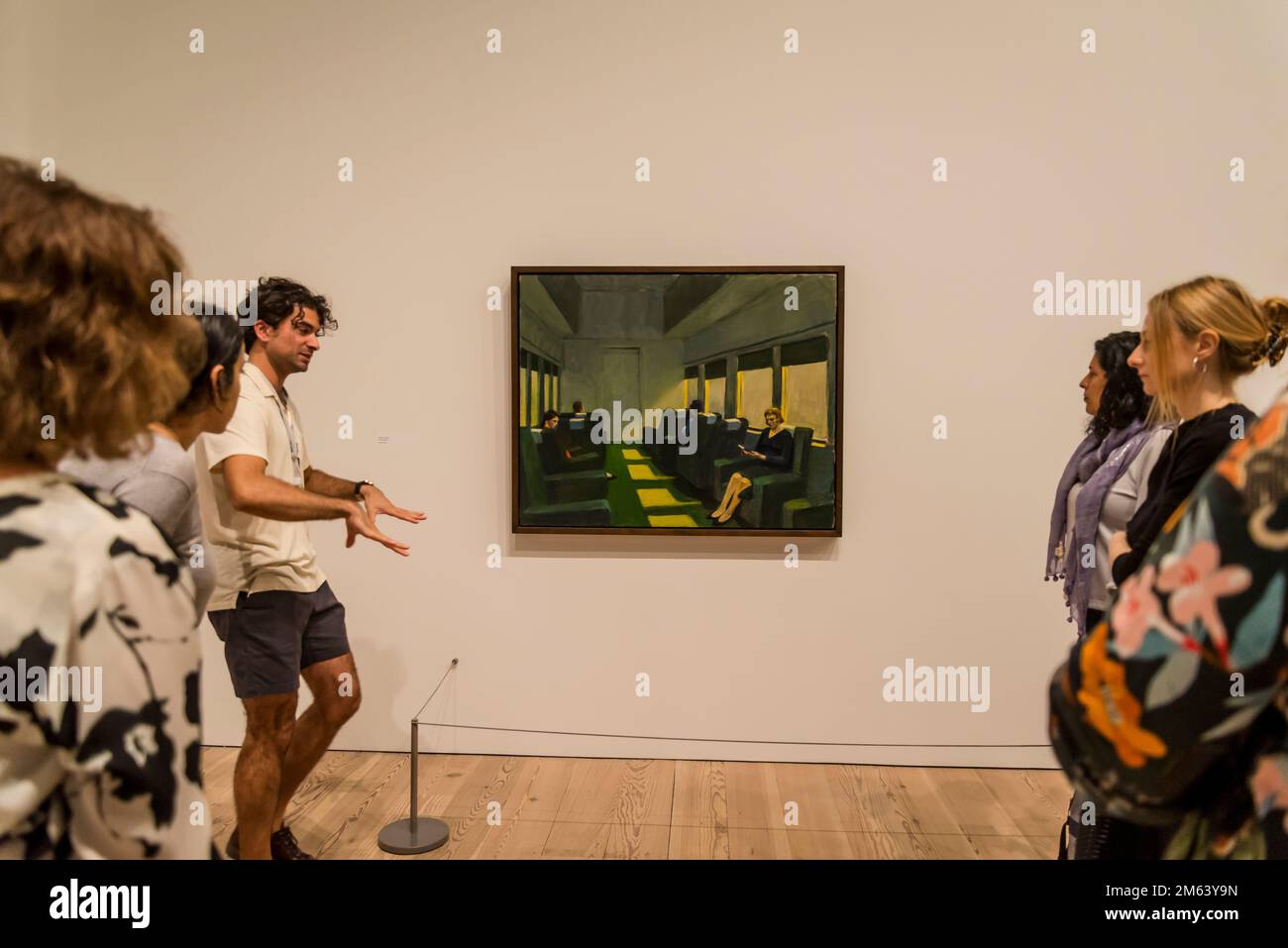 Curator explaining the painting Chair Car, 1965, Edward Hopper's New ...