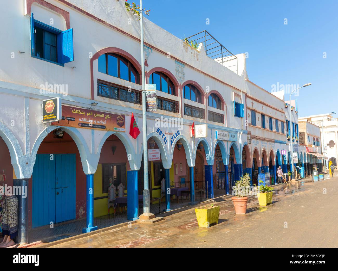 Historic buildings shops and hotel in arcaded shopping street in town ...