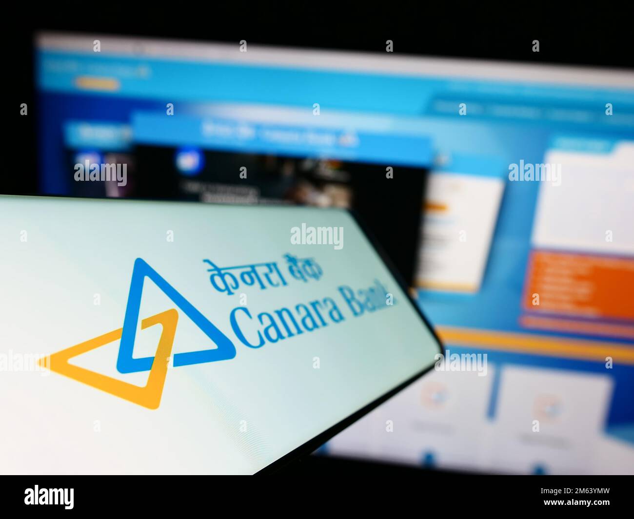 Mobile phone with logo of Indian financial company Canara Bank Ltd. on ...