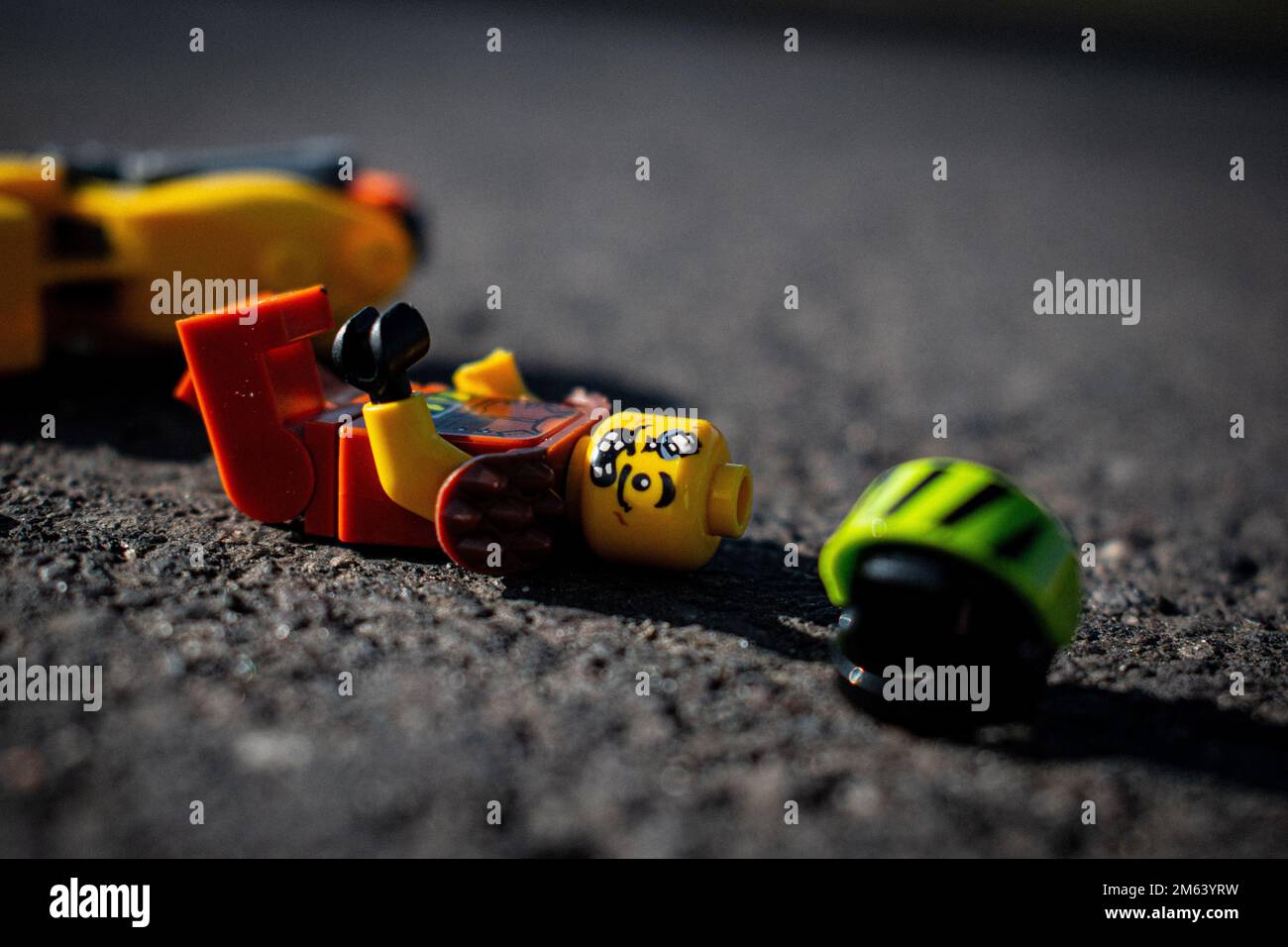 A Lego figure involved in a motorcycle crash in closeup Stock Photo - Alamy