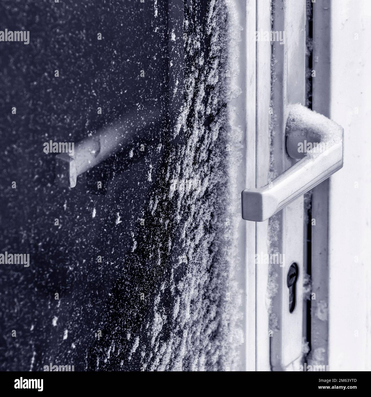 The white front door is covered with snow after a blizzard Stock Photo ...