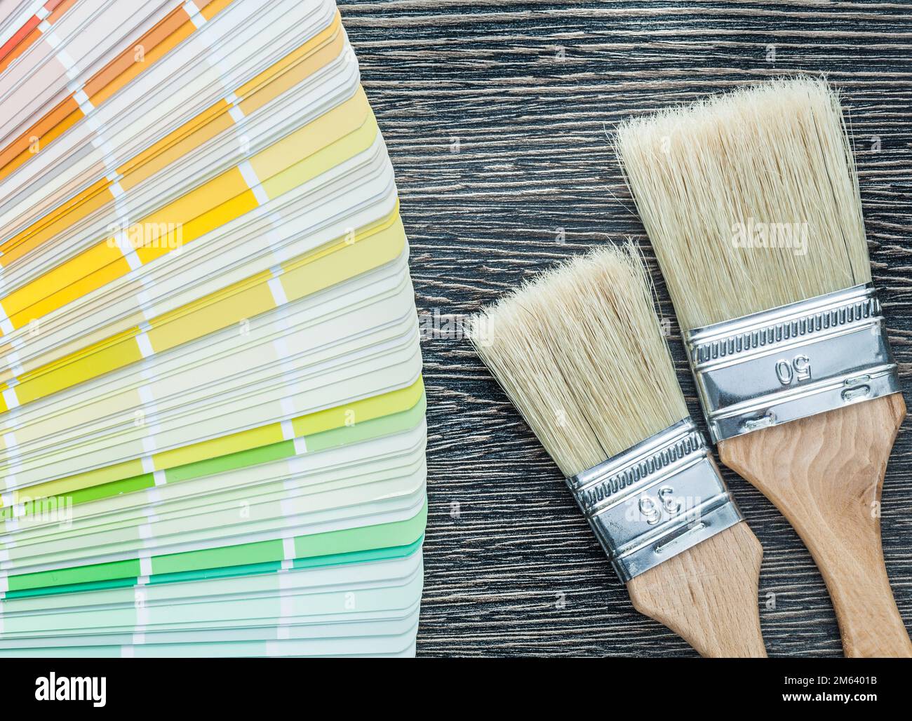 Color palette fan paintbrushes on wooden board Stock Photo - Alamy