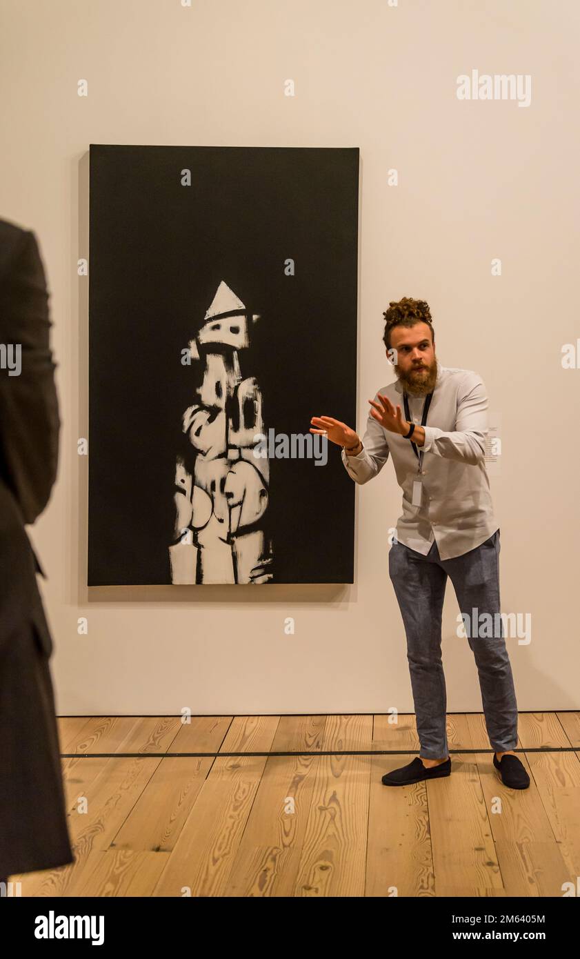 Curator explaining Norman Lewis painting American Totem, 1960, Whitney ...