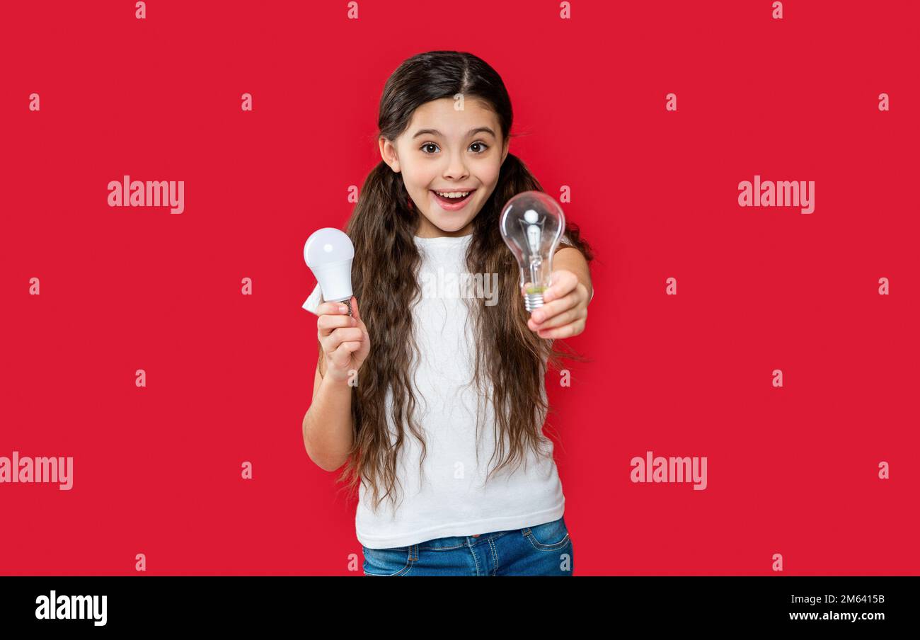 photo of amazed teen girl has solution with bulb. teen girl has ...