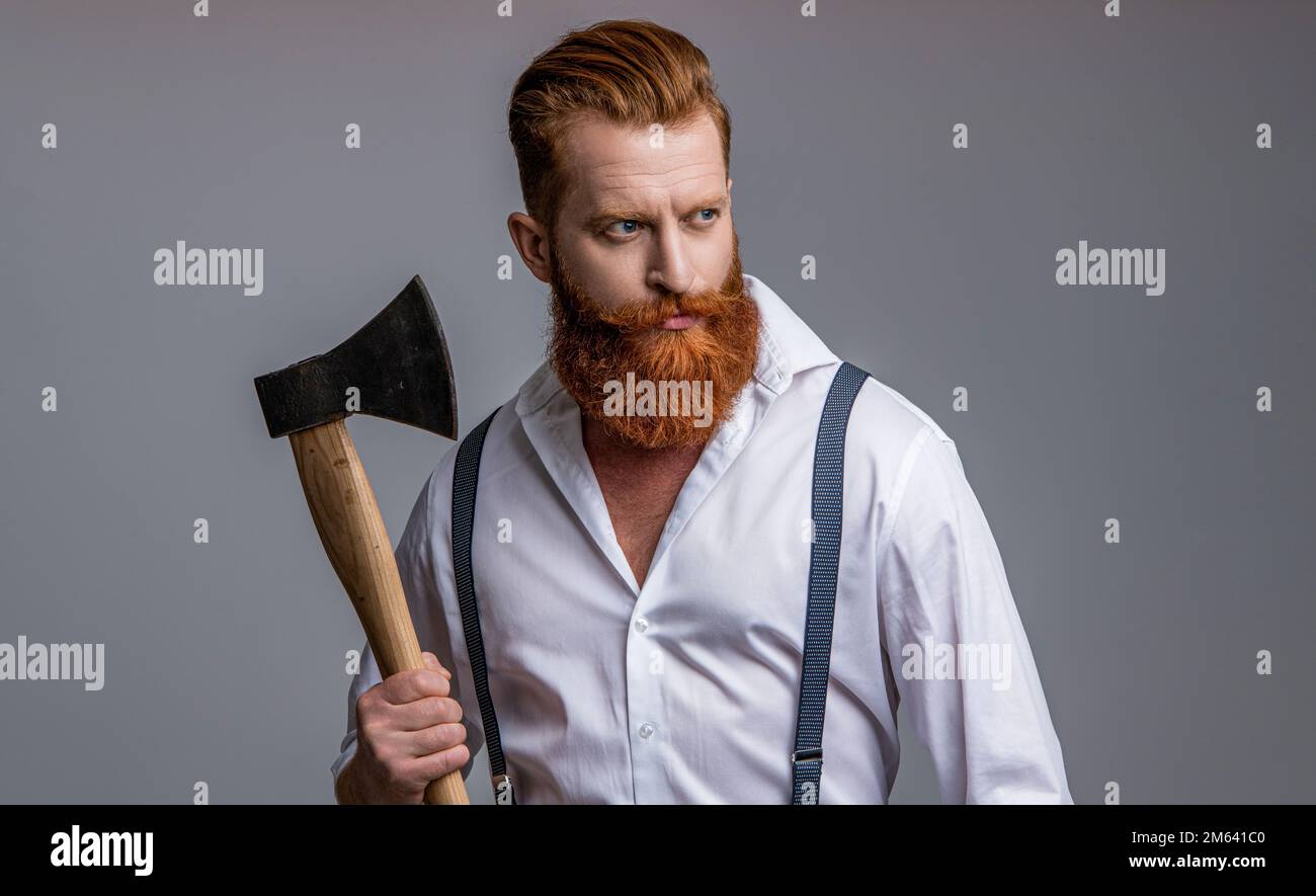caucasian brutal man with axe on background. photo of brutal man with ...