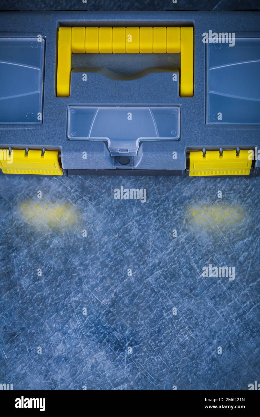 Copy space image of closed toolkit on scratched metallic background ...