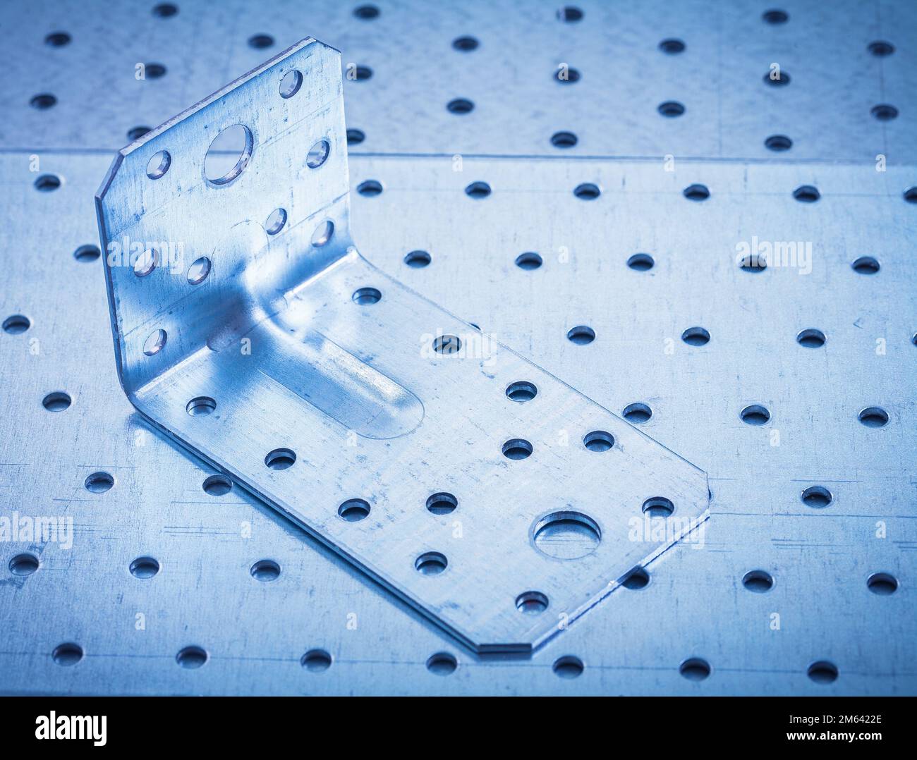 Drilled angle bar on perforated metallic sheet construction concept ...