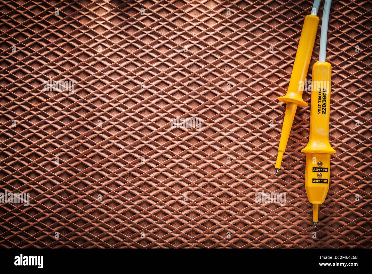 Electric tester on dielectric rubber mat Stock Photo - Alamy