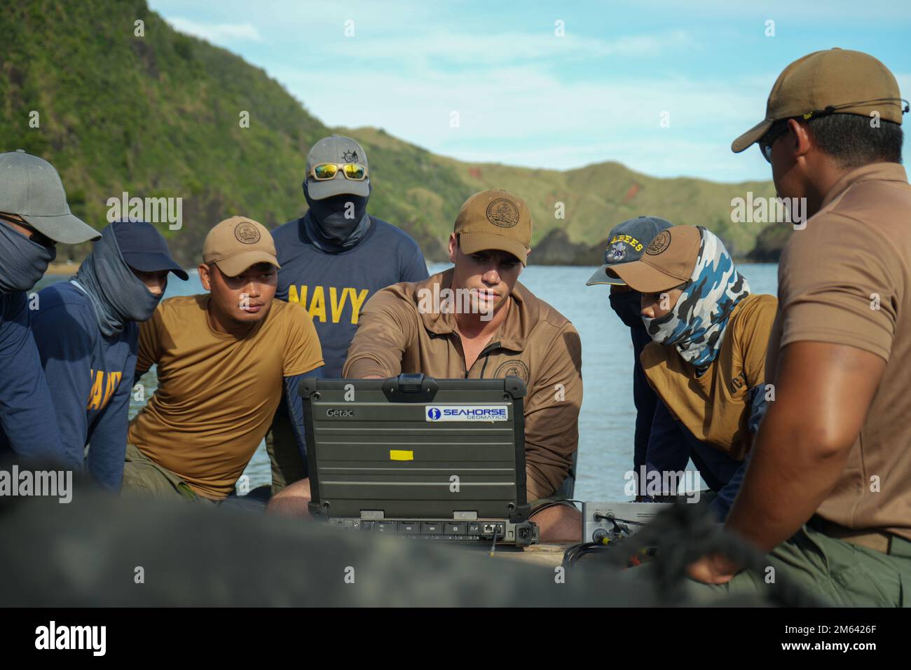 U.S. and Philippine Sailors use a NORBIT sonar device to conduct ...