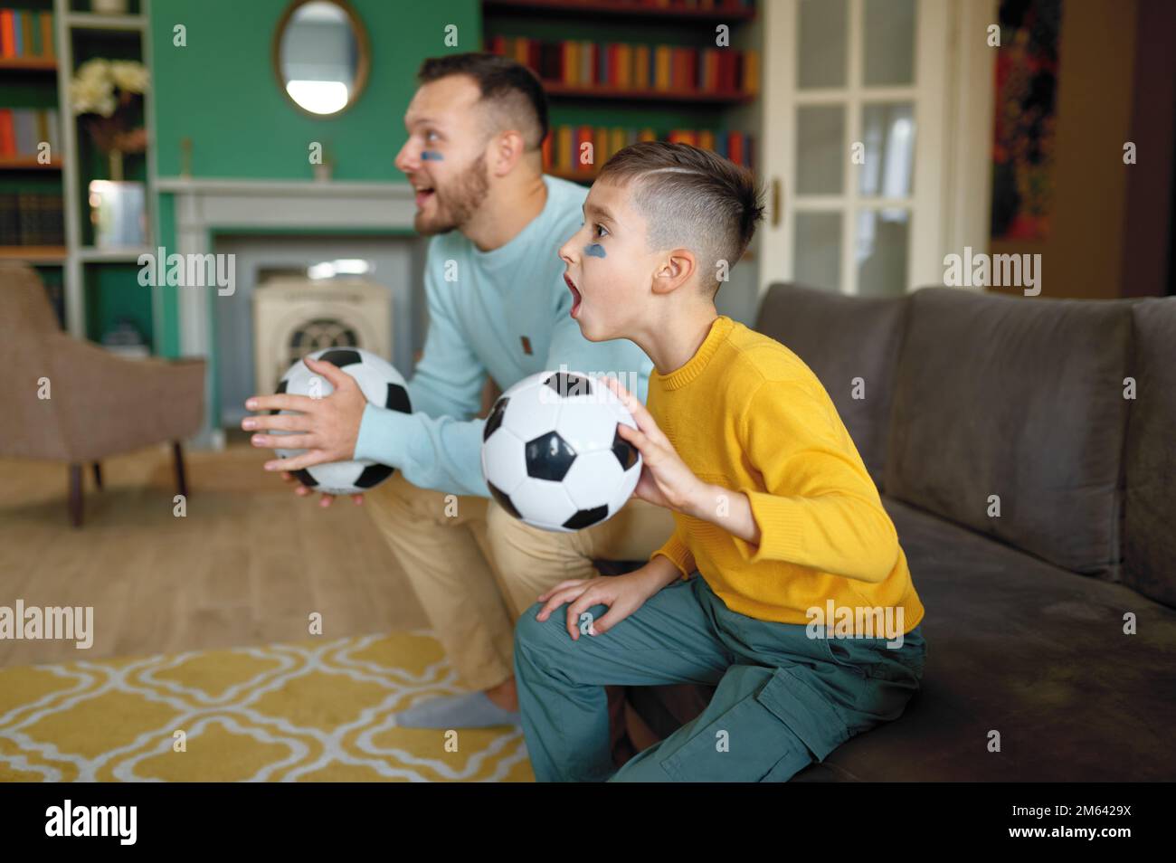 Family cheering watching soccer game hi-res stock photography and ...