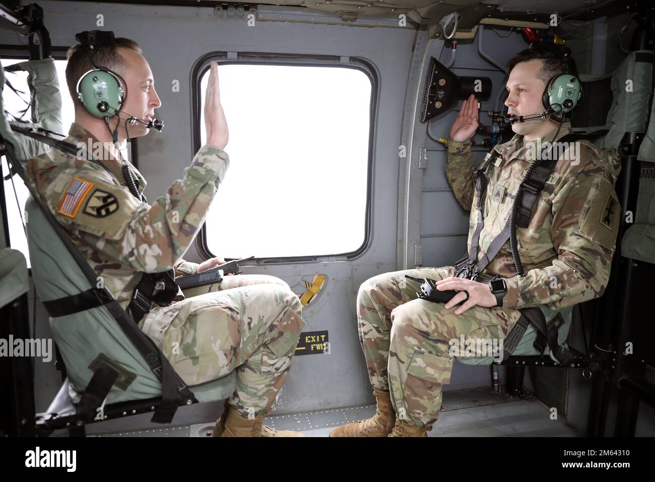Sgt. James Gerig raises his right hand as the Oath of Enlistment is ...