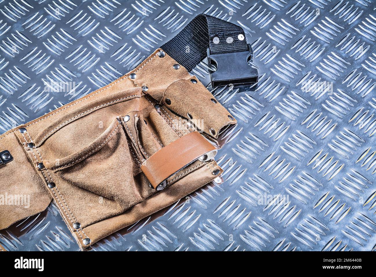 Leather building belt on grooved metal sheet construction concept Stock ...