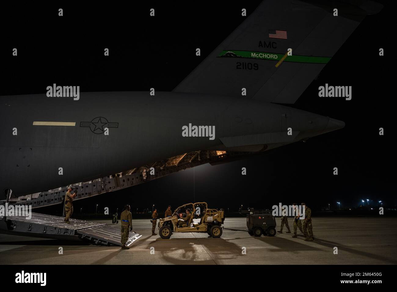 U.S. Airmen from the 60th Aerial Port Squadron ramp services and 8th ...