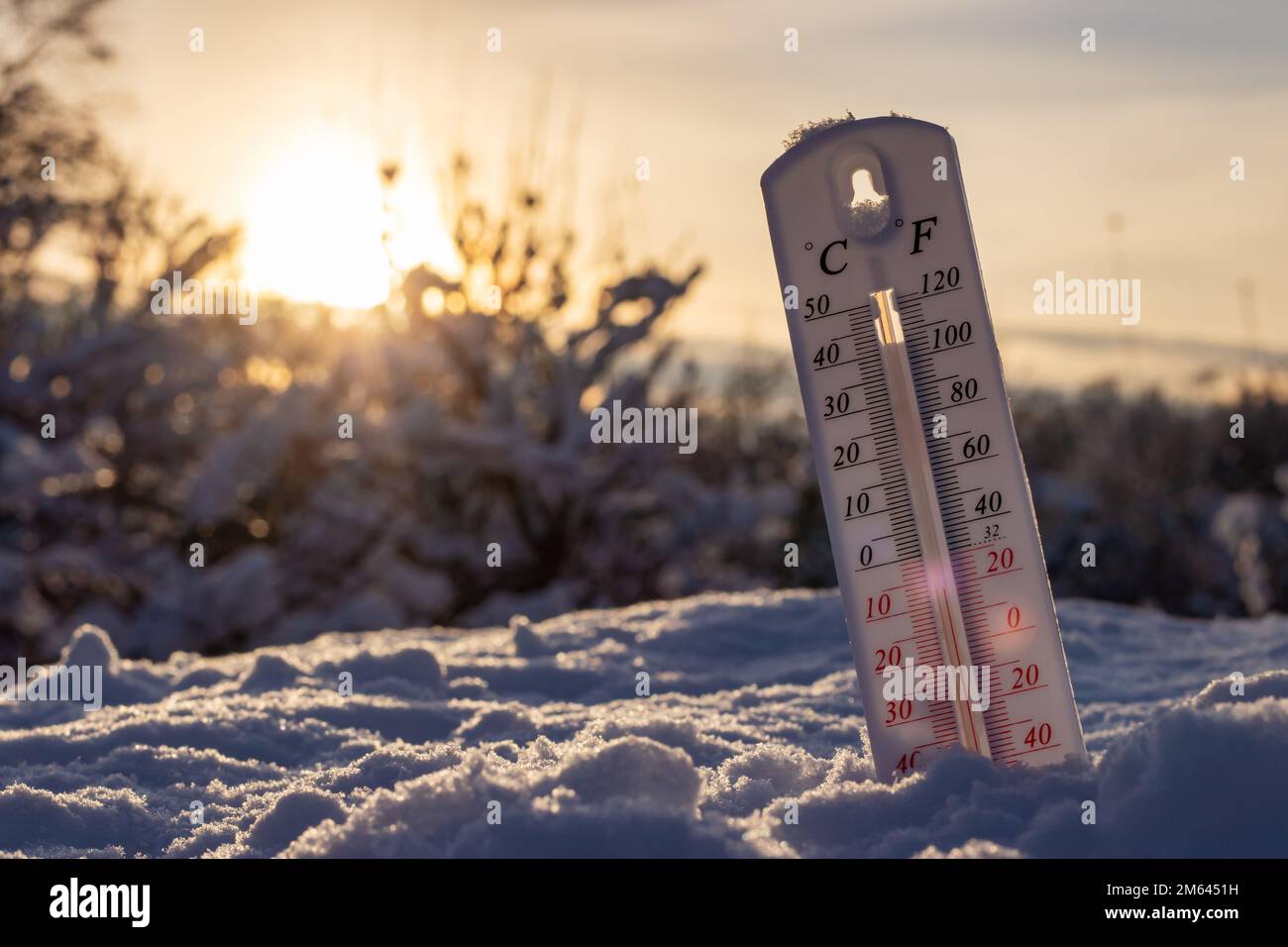 Thermometer with minus temperatures in the snow in winter hi-res stock ...