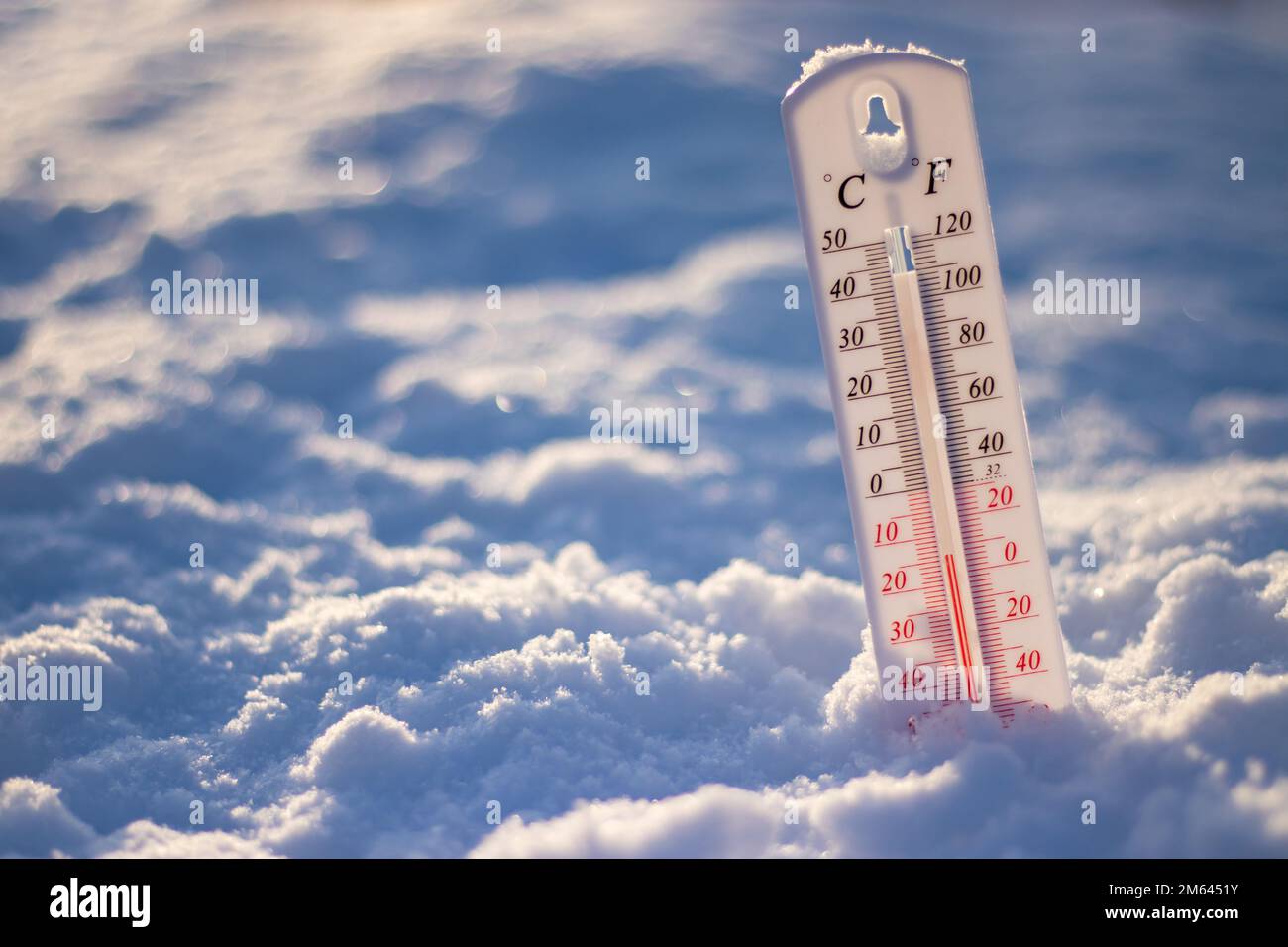 Thermometer in the snow. Extreme cold temperature at winter Stock Photo ...