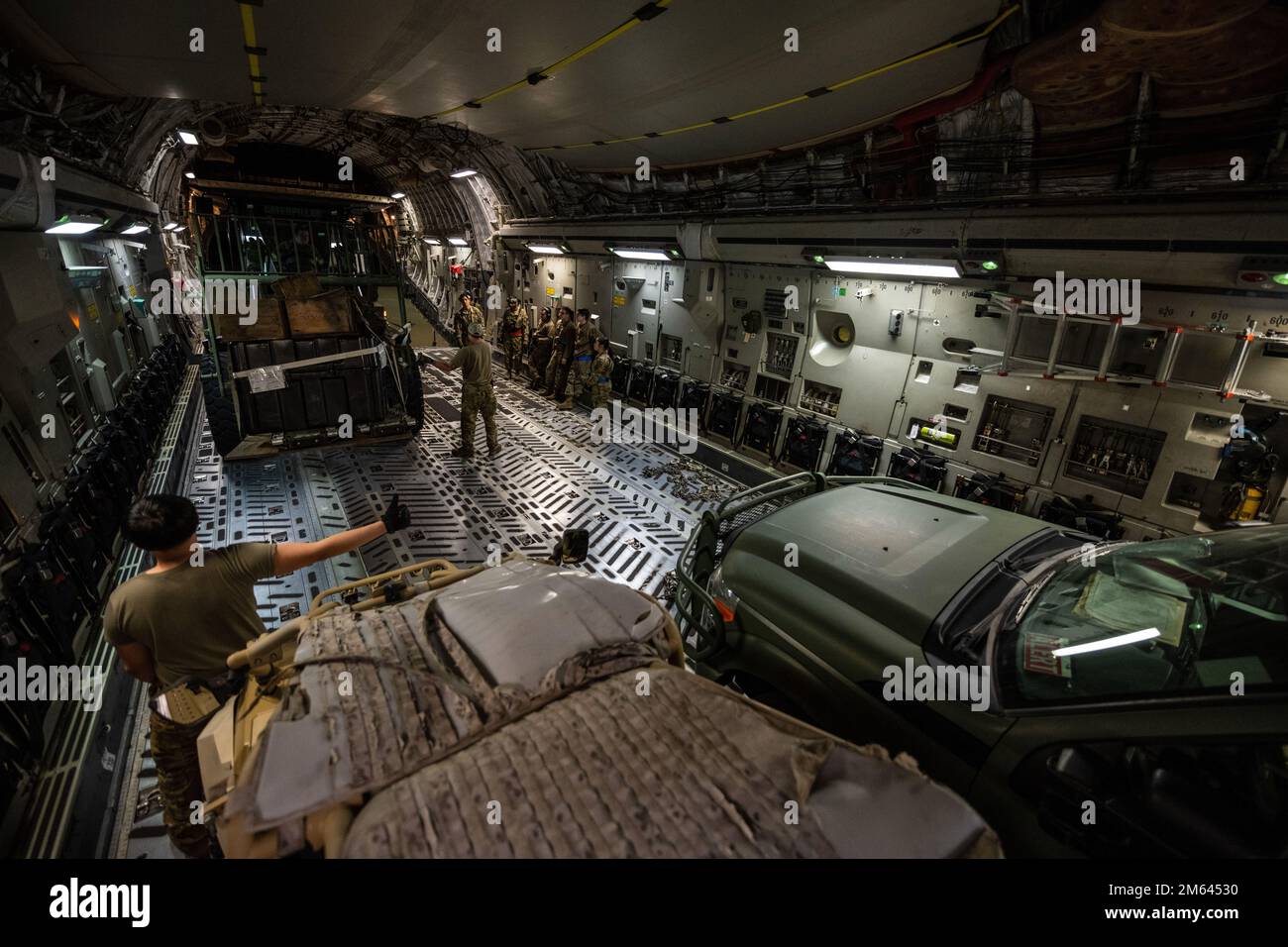 U.S. Airmen from the 60th Aerial Port Squadron ramp services and 8th ...